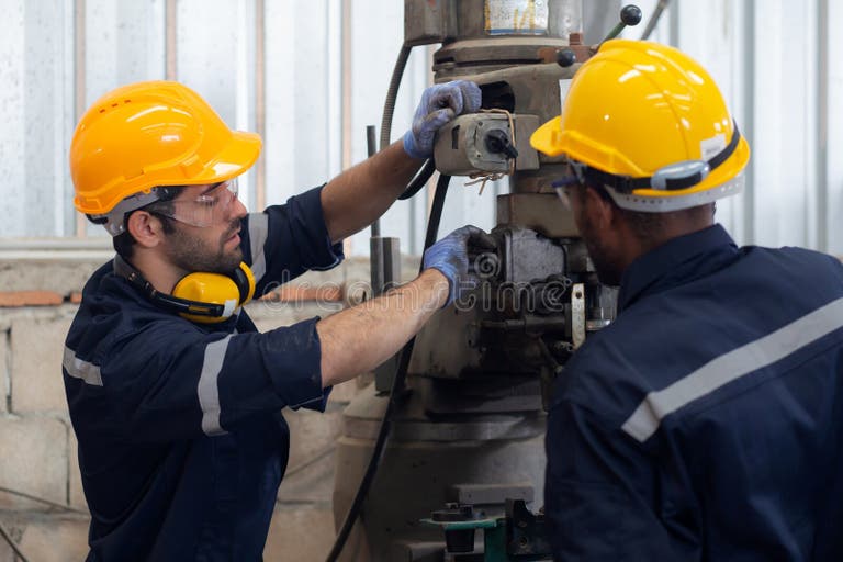 Engineer Man Training with Foreman for Apprentice Using Lathe, Apprenticeship Teaching with ...