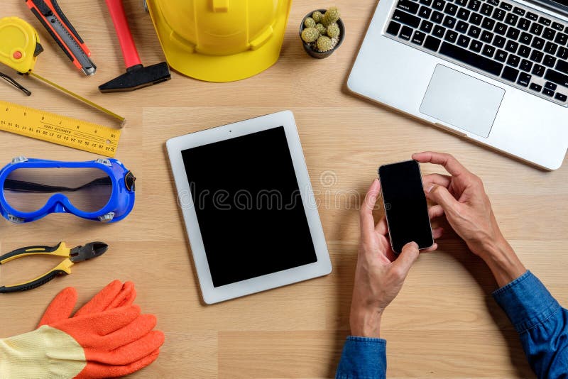 Engineer Man Using Smart Phone in Hands Touching on a Screen Stock ...
