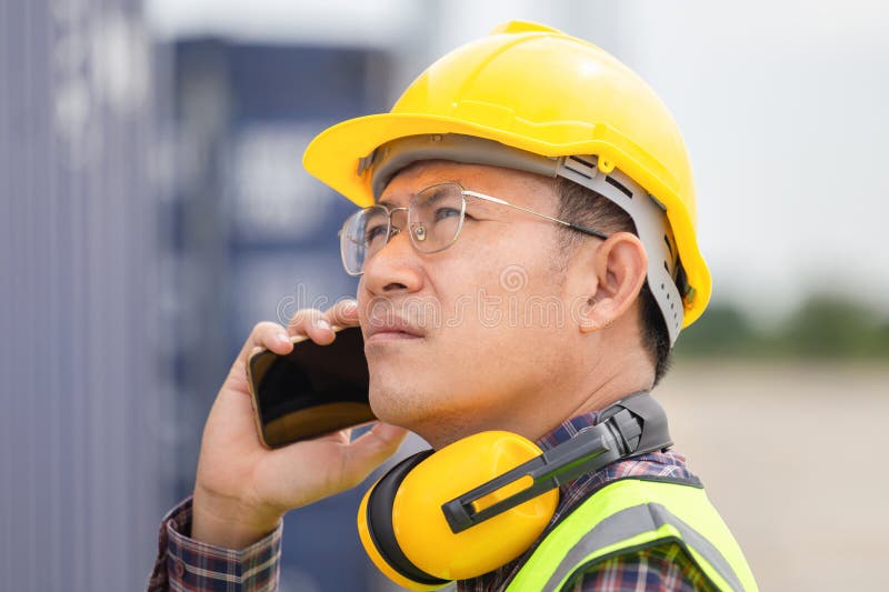 Engineer Man Using Smartphone in Industry Containers Cargo, Foreman ...