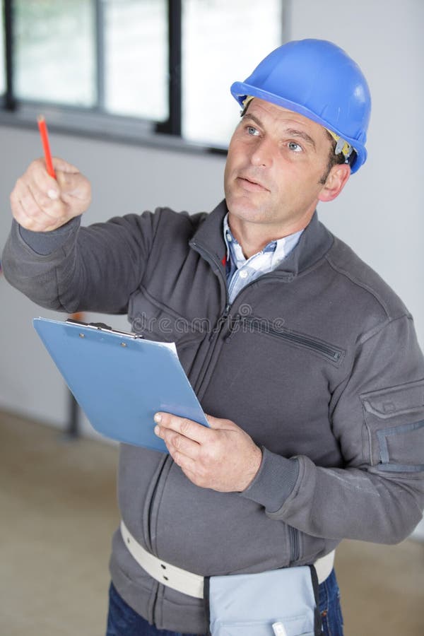 Engineer Man Wearing Helmet Holding Clipboard Pointing Stock Photo ...