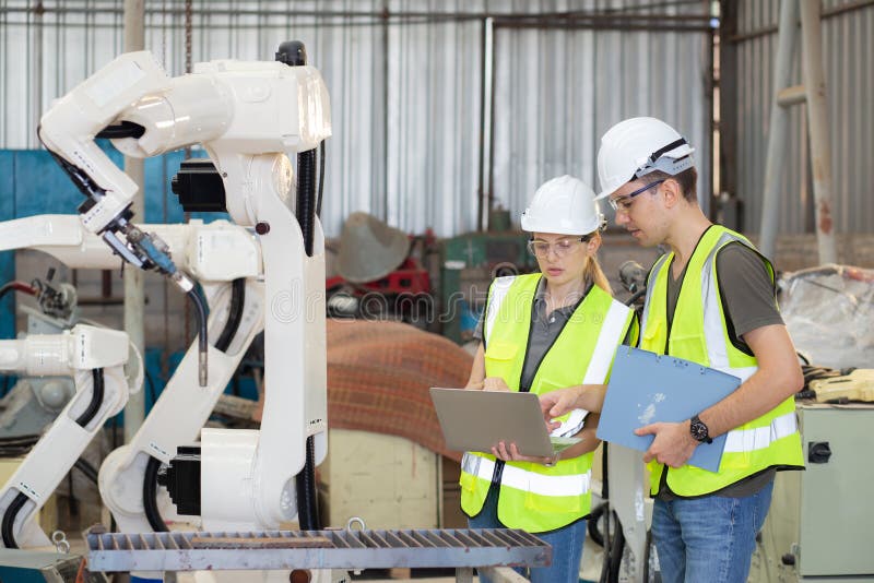 Engineer Man and Woman Talking and Explaining about Robot Arms ...