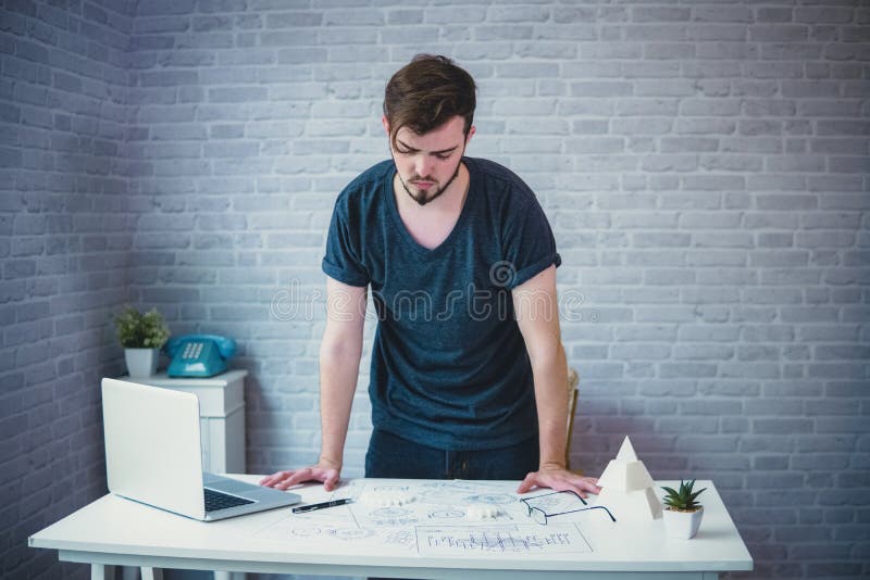 Engineer Man Working on Blueprint for Designing Mechanical Parts Stock ...