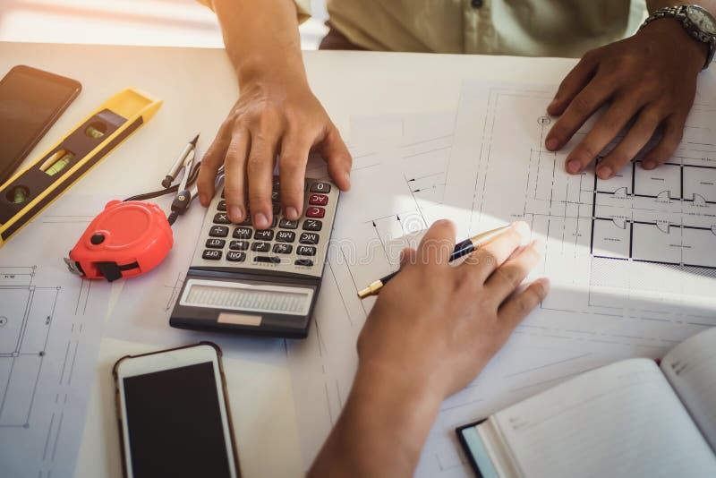 Engineer Man Working with Drawings Inspection in Workplace in Office ...