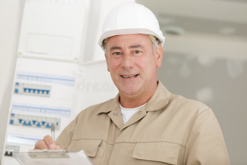 Engineer Man Writing on Clipboard Stock Image - Image of elegance ...