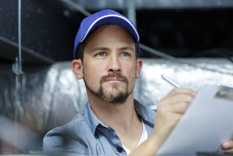 Engineer Man Writing Notes on Clipboard Stock Photo - Image of pure ...