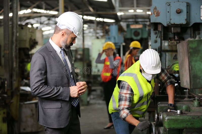 Manager on factory floor stock photo. Image of environment - 14219536