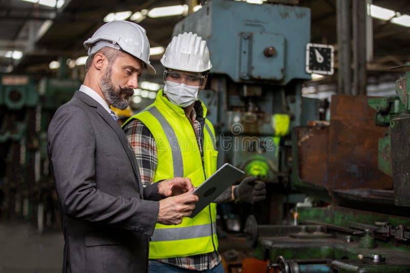 Engineer Manager and Factory Workers Team Checking Machine in ...