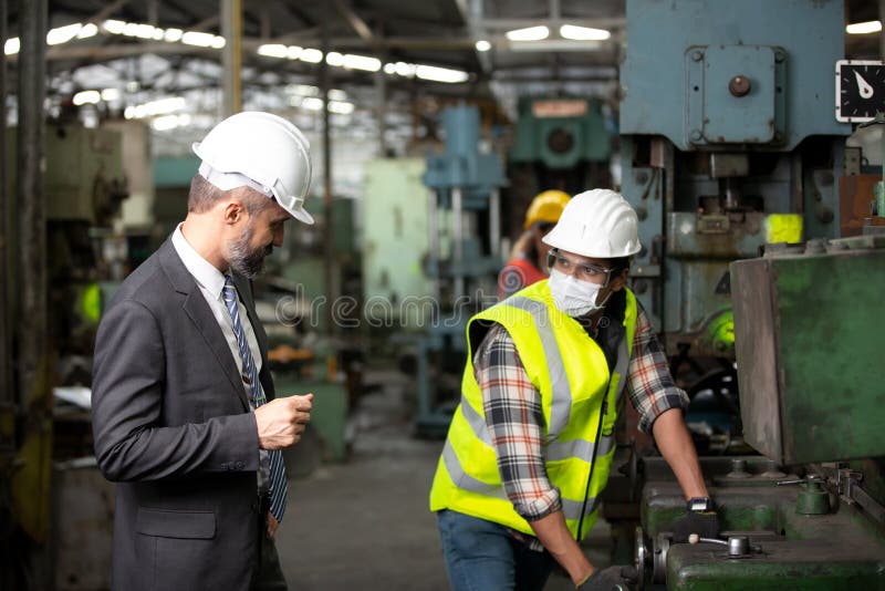 Manager on factory floor stock photo. Image of environment - 14219536