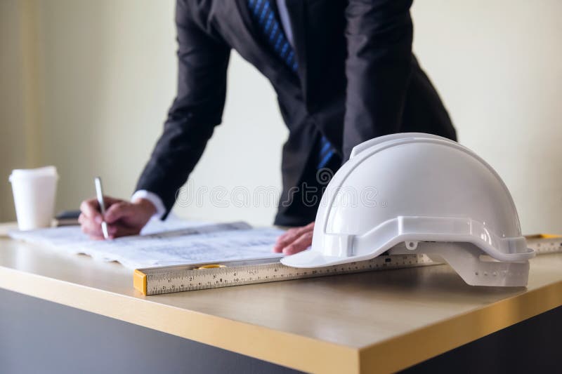 Engineering Helmet on Businessman Table Stock Photo - Image of business ...