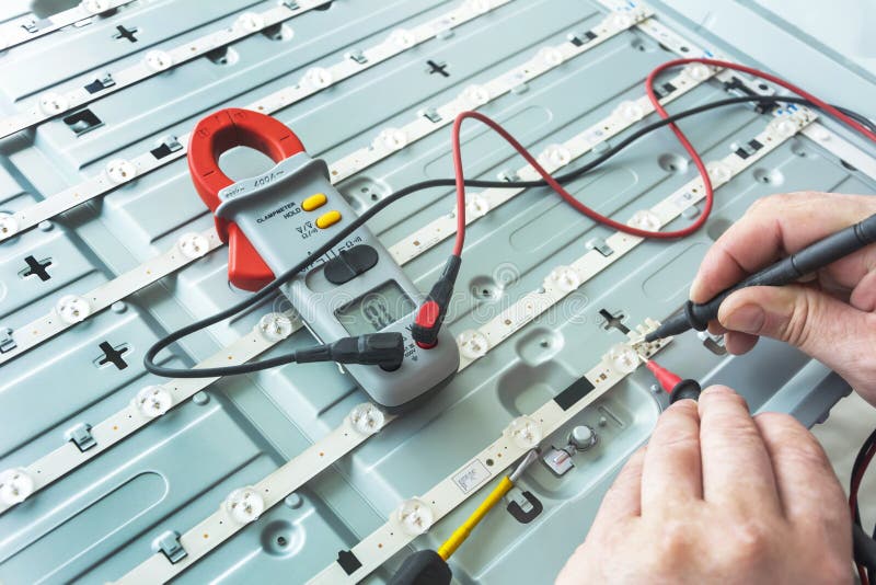 The Engineer Measures the Voltage on the LED Board with a Multimeter ...