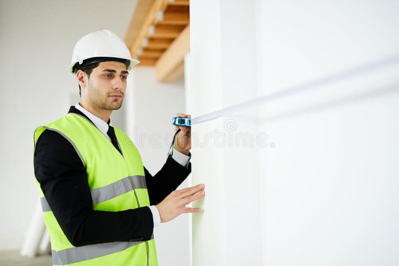 Engineer Measuring Walls stock image. Image of developer - 147524747