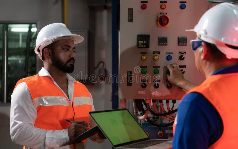 Engineer of a Mechanical Plant Inspecting and Explaining the ...