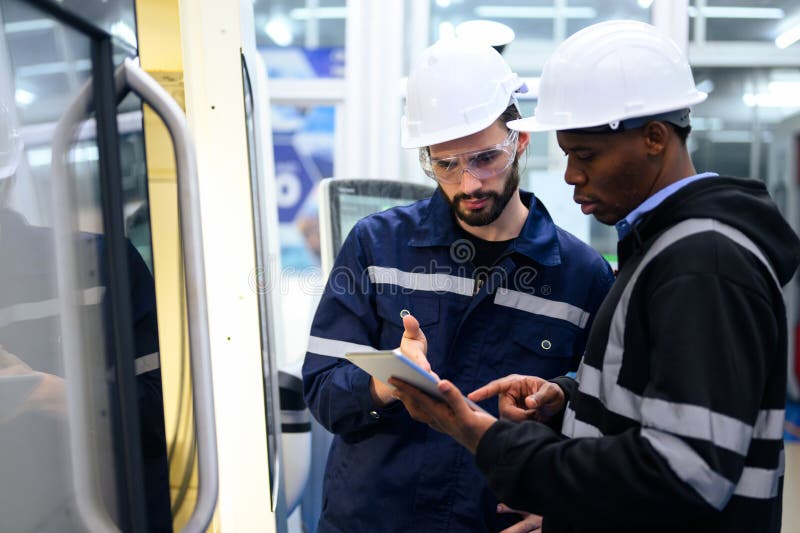 Engineer Mechanician Operating and Controlling CNC Machine Stock Photo ...