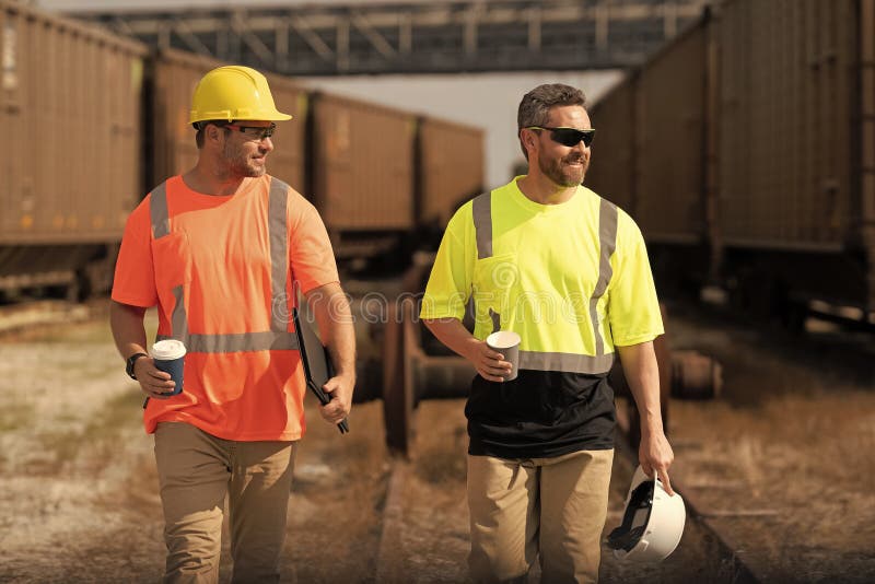 Engineer Men at Construction Site Having Coffee Break. Engineer Men at ...