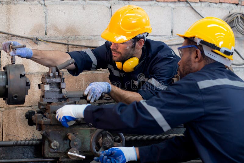 Engineer Man Training with Foreman for Apprentice Using Lathe ...