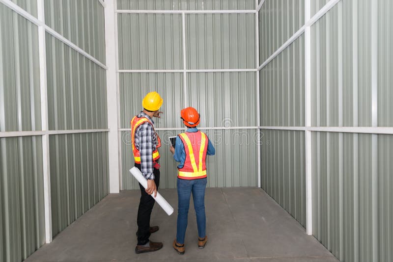 Engineer Man and Woman Talking about the Construction of the Building ...