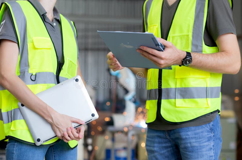 Engineer Man and Woman Talking and Explaining about Robot Arms ...