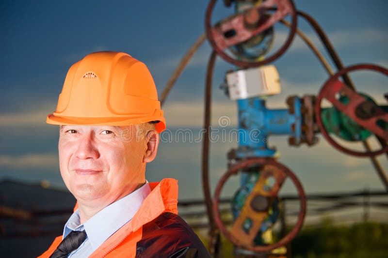 Engineer in an Oil field stock photo. Image of business - 21476144