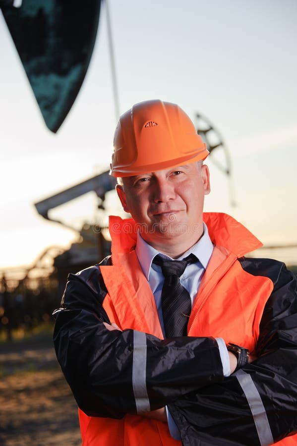 Engineer in an Oil field stock photo. Image of business - 21476144