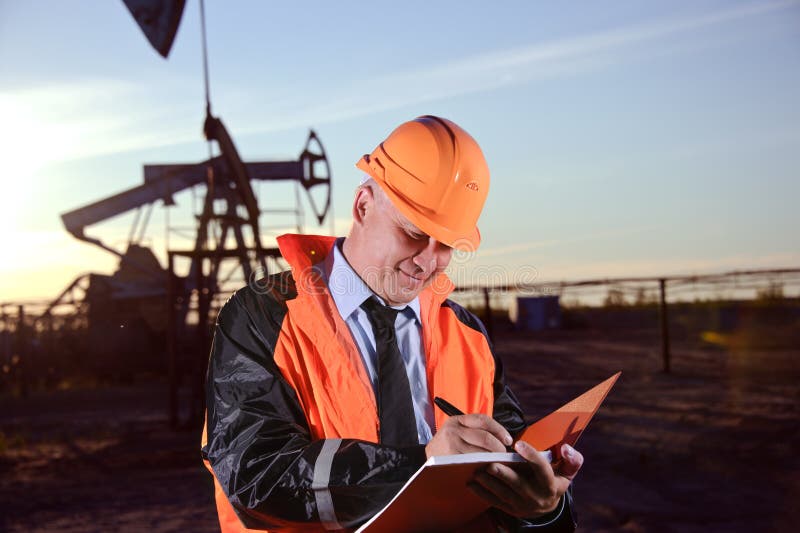 Engineer in an Oil field stock photo. Image of business - 21476144