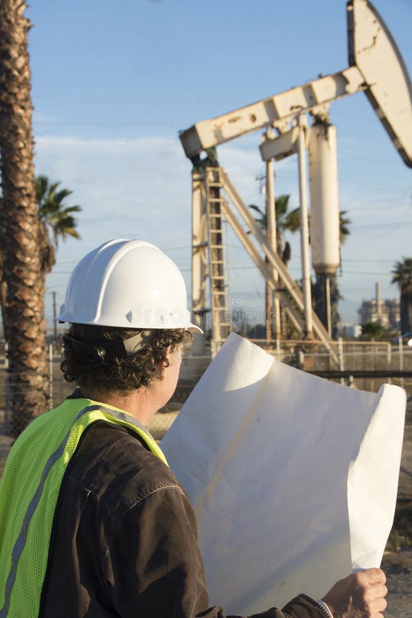 Engineer at oil pump stock image. Image of structure - 47134093