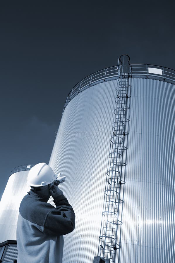 Engineer and oil tanks stock image. Image of technology - 3800001