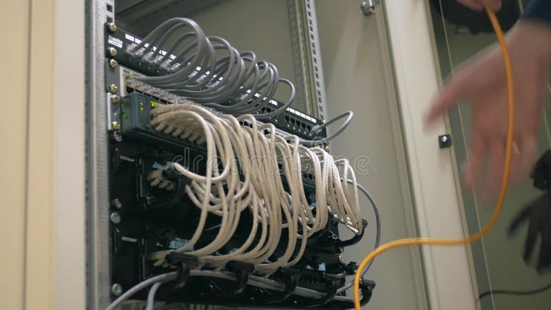 It Engineer Open Server Rack and Plug Out Cable Stock Footage - Video ...
