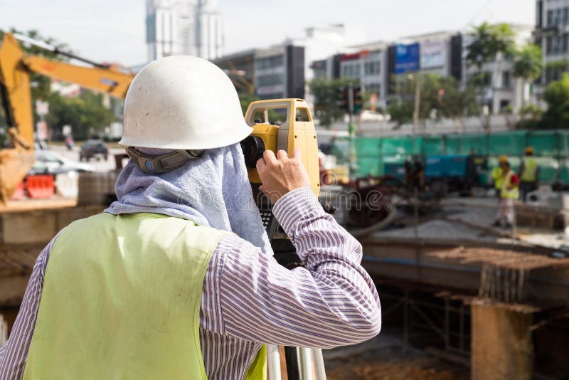 Engineer Operating the Dumpy Automatic Level Instrument at Construction ...