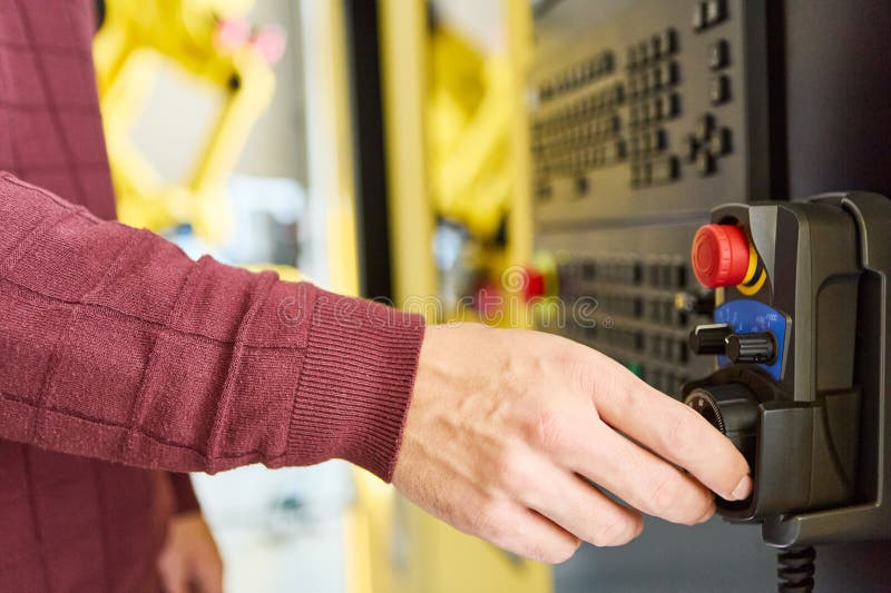 Engineer Operating Industrial Robot Controller in Manufacturing ...
