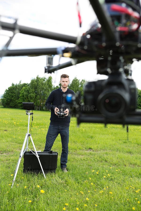 Engineer Flying UAV Helicopter In Park Stock Image - Image of multi ...