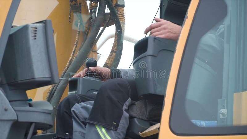 Engineer Operator Crane in Action. Clip. Man in Cabin Controls the ...