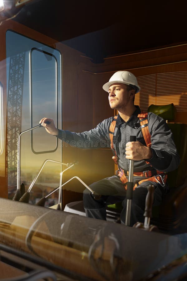 Engineer Operator Crane in Action . he Sit a Top in Crane Cabin and ...