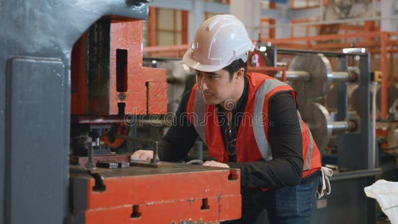 Engineer or Operator Wearing a Safety Suit Working Bending Metal Sheet ...