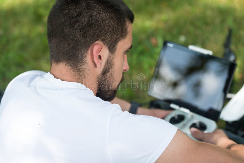 Engineer Outdoors with Remote Control Preparing the Drone Stock Photo ...