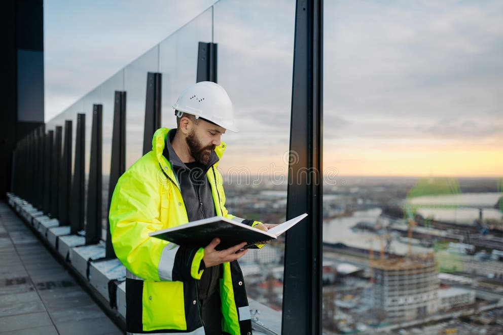 Engineer Overseeing City Construction Project with Blueprints in Hand ...