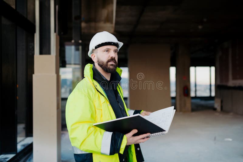 Engineer Overseeing City Construction Project, Reading Documentation ...