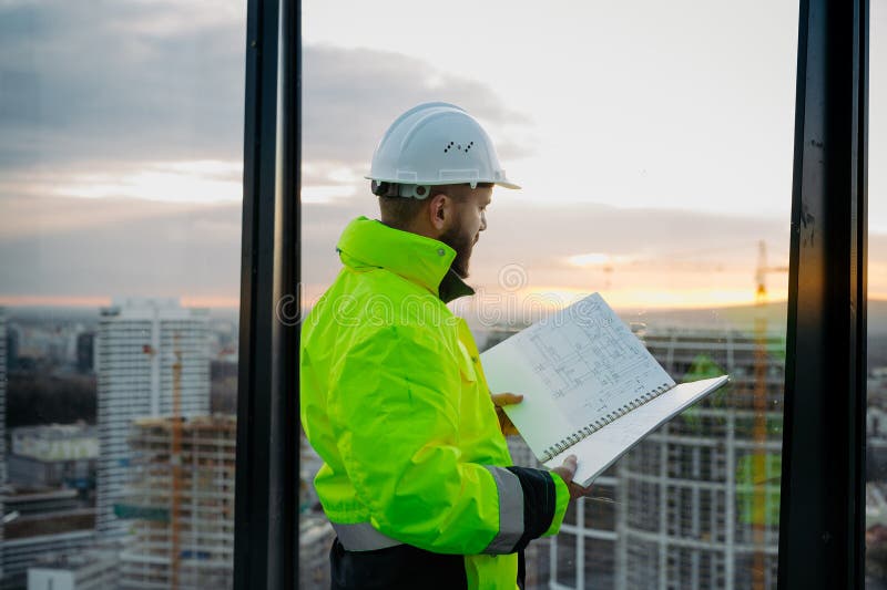 Engineer Overseeing City Construction Project Reading Documentation ...