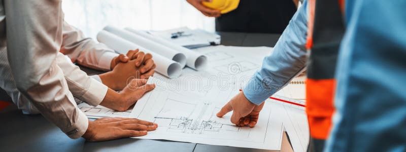 Engineer Partner Drawing and Working on Blueprint Design Together ...