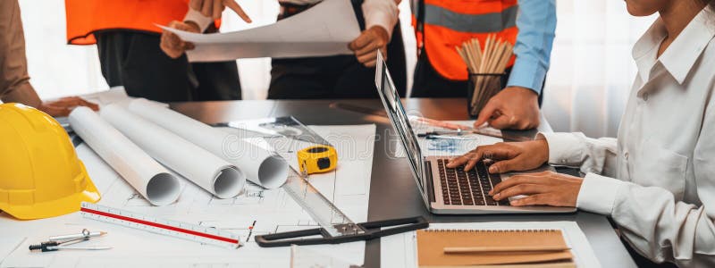 Engineer Partner Drawing and Working on Blueprint Design Together ...