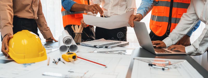 Engineer Partner Drawing and Working on Blueprint Design Together ...