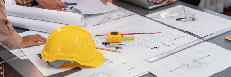 Engineer Partner Drawing and Working on Blueprint Design Together ...