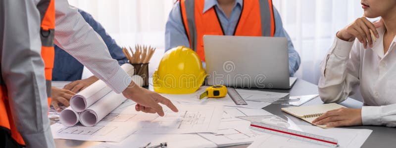 Engineer Partner Drawing and Working on Blueprint Design Together ...