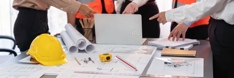 Engineer Partner Drawing and Working on Blueprint Design Together ...