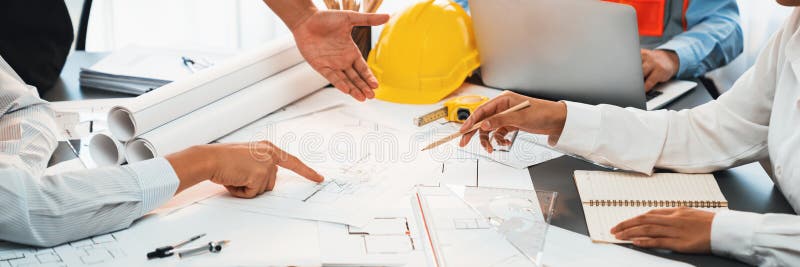 Engineer Partner Drawing and Working on Blueprint Design Together ...