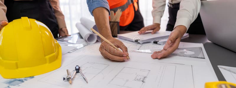 Engineer Partner Drawing and Working on Blueprint Design Together ...