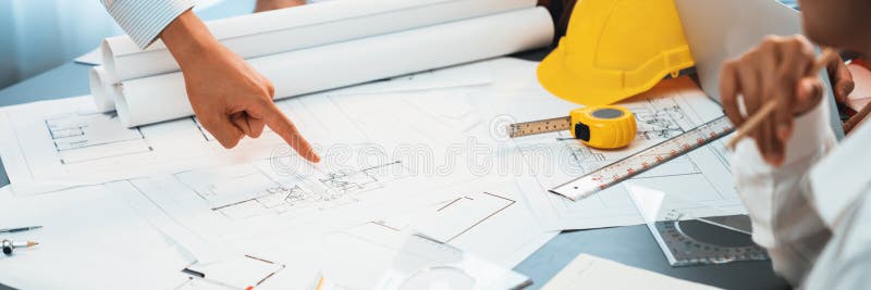 Engineer Partner Drawing and Working on Blueprint Design Together ...