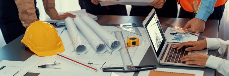 Engineer Partner Drawing and Working on Blueprint Design Together ...