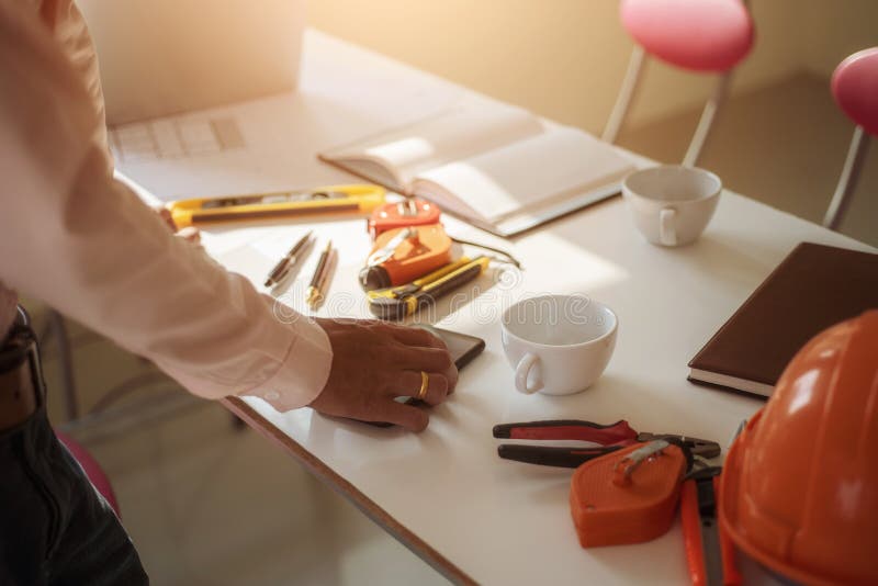 Engineer People Meeting Working and Pointing at a Drawings in Office ...