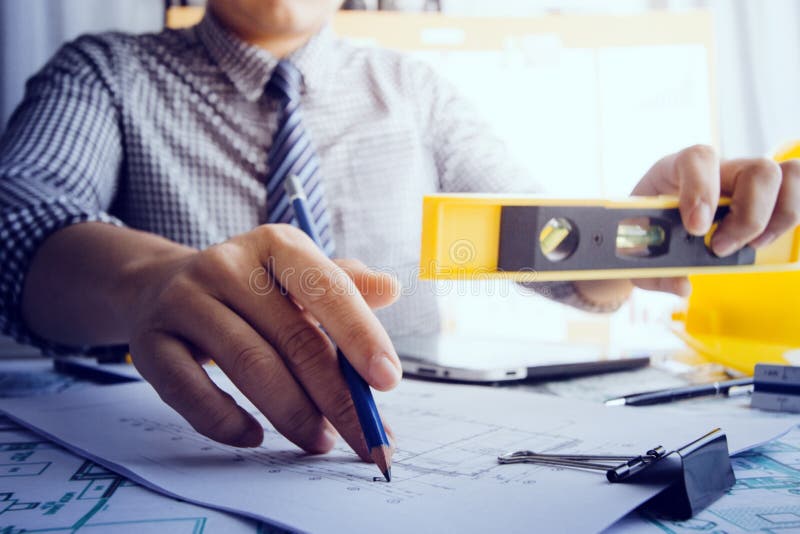 Engineer People Meeting Working and Pointing at a Drawings in Office ...