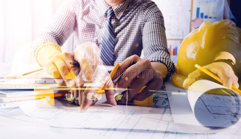 Engineer People Meeting Working and Pointing at a Drawings in Office ...